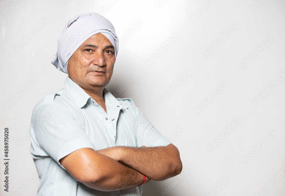 portrait of a confident indian rural man mid aged farmer on white ...