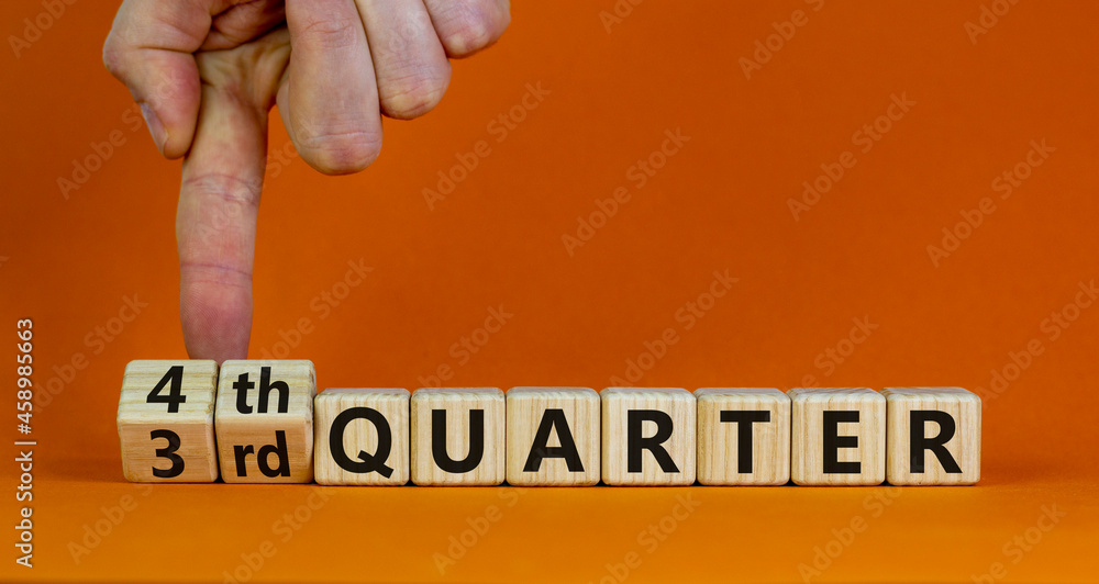 From 3rd to 4th quater symbol. Businessman turns cubes and changes ...
