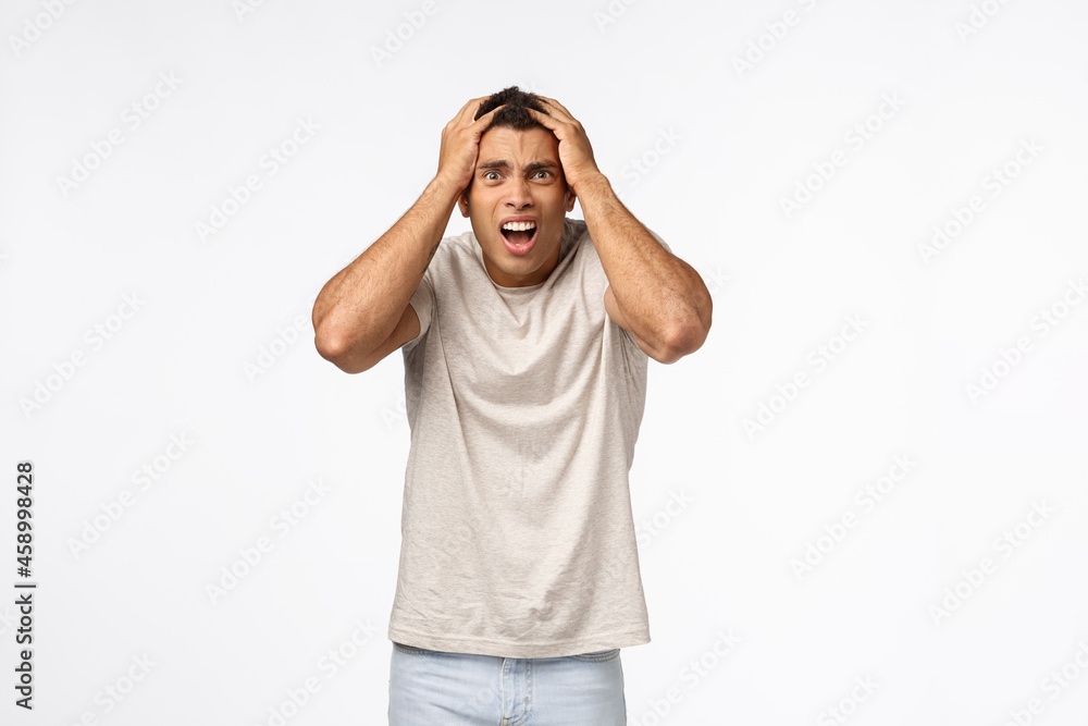 Man in panic feeling frustrated, alarmed, grab head staring upset ...