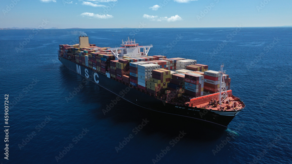 Aerial drone photo of MSC truck size container cargo vessel cruising in ...