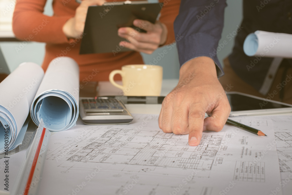 Architect working on blueprint. Architects workplace - architectural ...