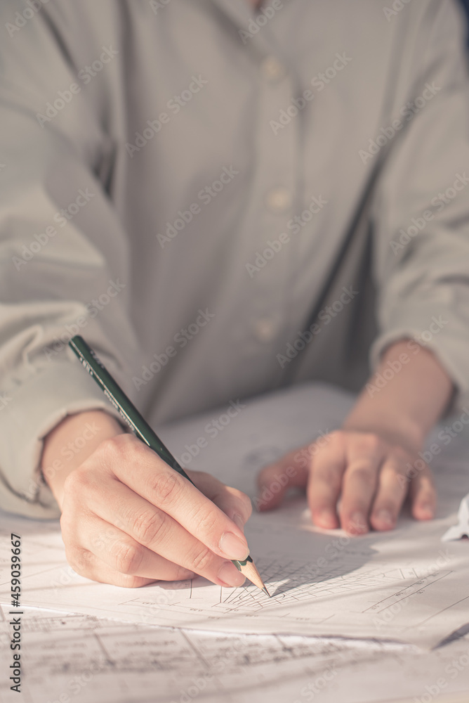 Architect working on blueprint. Architects workplace - architectural ...
