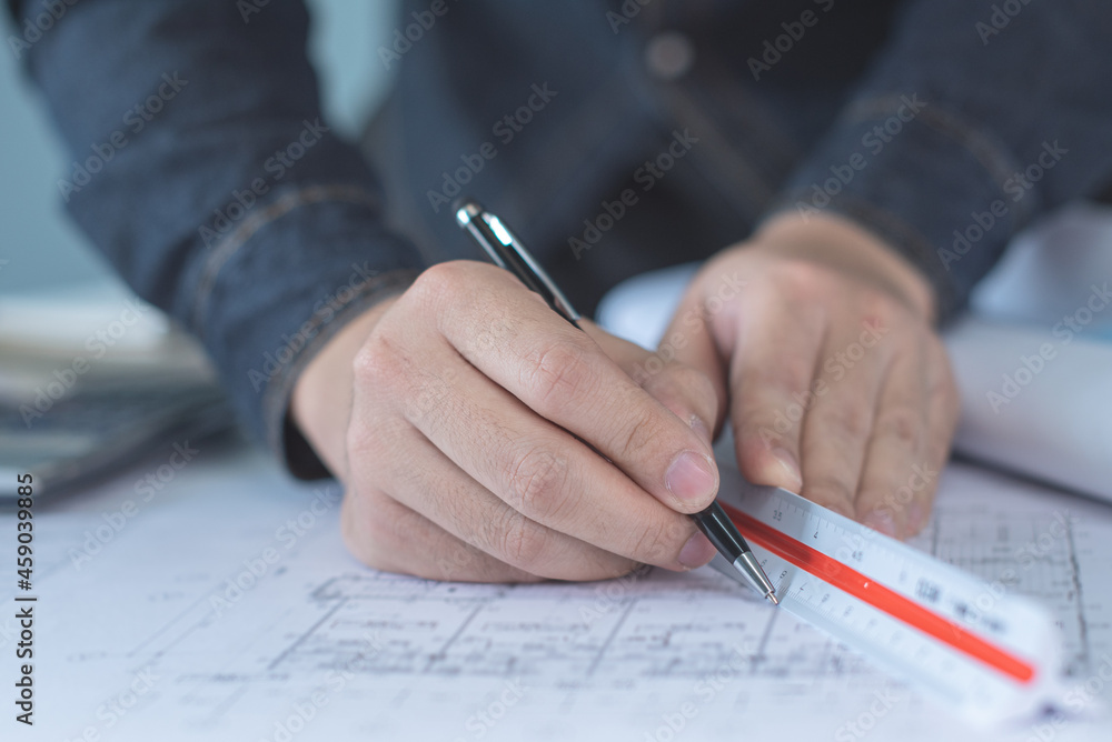 Architect working on blueprint. Architects workplace - architectural ...