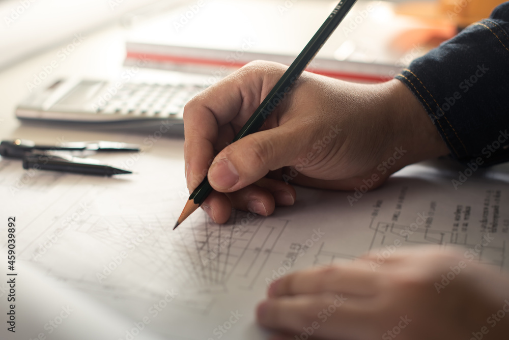 Architect working on blueprint. Architects workplace - architectural ...