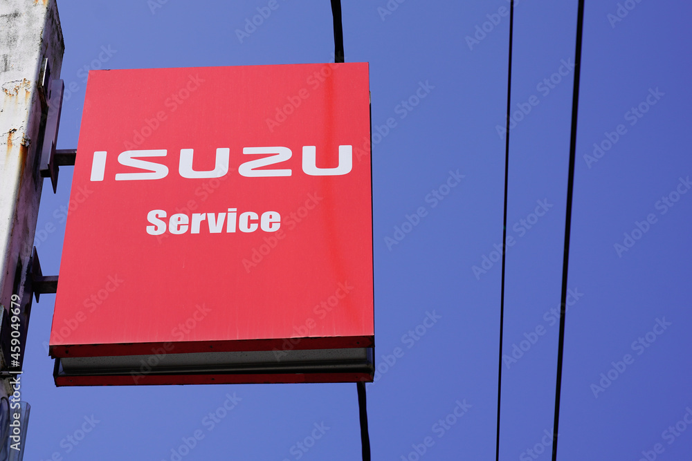 Isuzu car truck sign logo and brand text in street dealership garage ...
