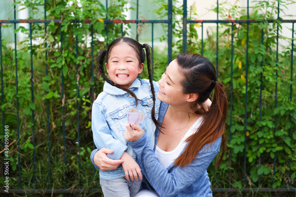 Happy asian family single mom and small daughter in the Park Stock ...