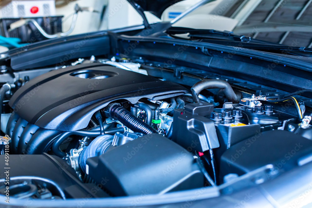 Selective focus to automotive industrial part of modern new car engine ...