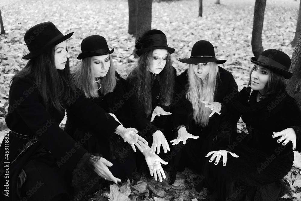 Coven of witches, modern witches gathered and do a ritual in the Park ...