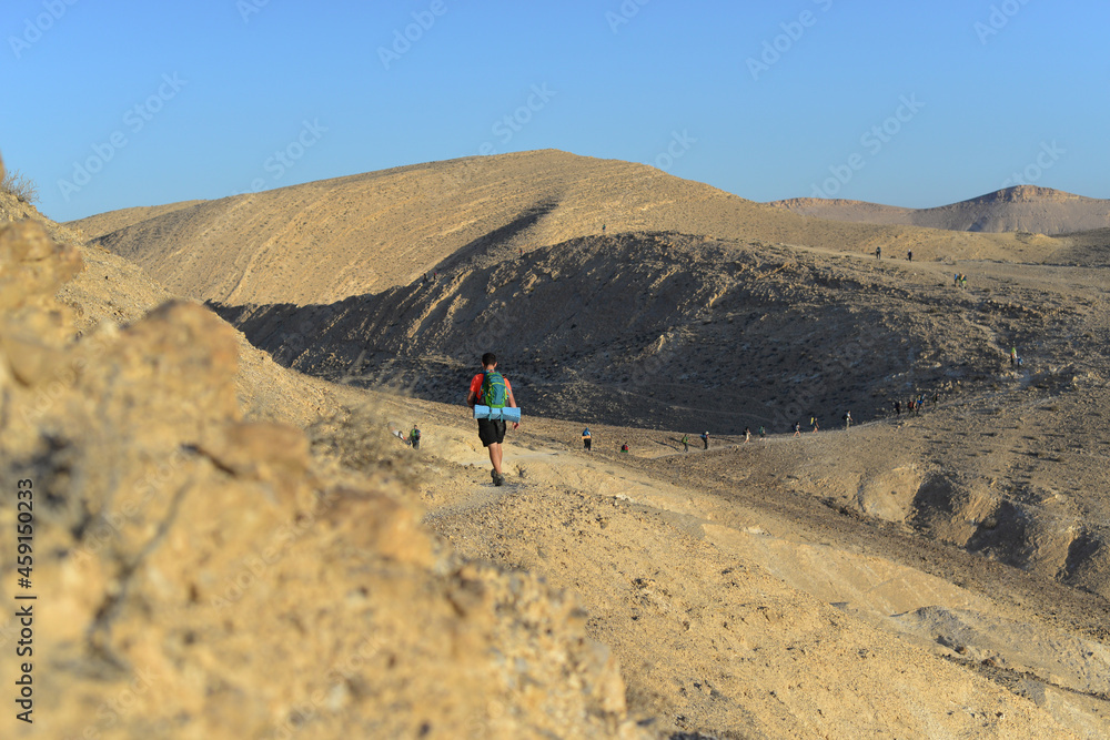 Fotografia do Stock: Group of tourists hiking. Group of travelers on a ...
