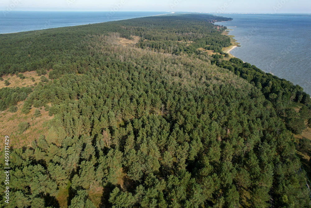 Aerial view with dunes, forest and sea in Curonian spit on a sunny day ...