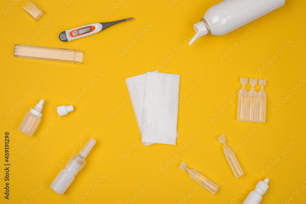 Different types of medical drops, nasal spray and nasal spray on yellow ...