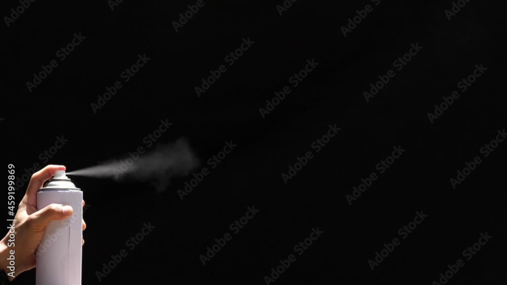 Slow motion speed closeup scene in side view of aerosol can when ...