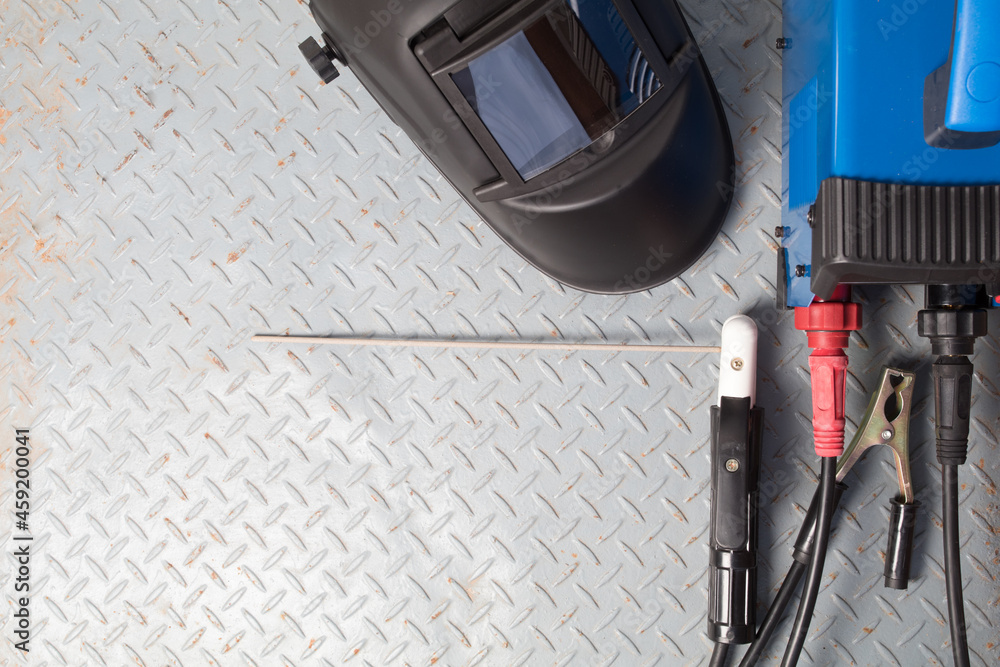 Welding equipment on a metal desk with workshop welding mask,welding ...