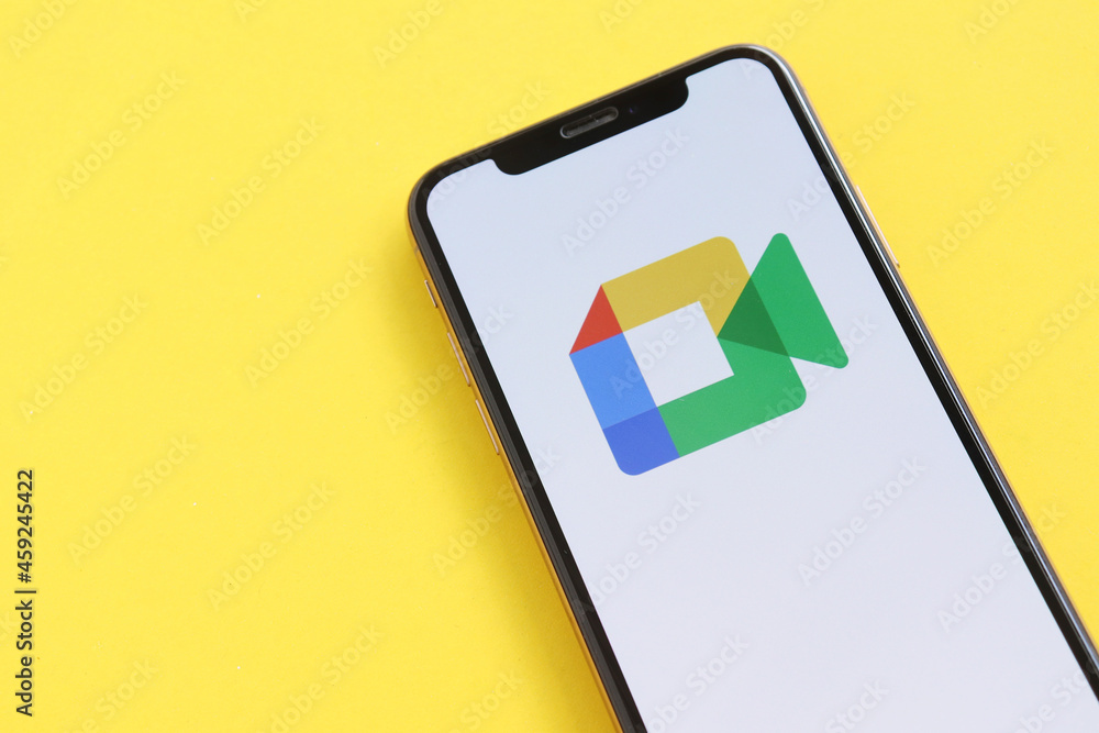 Google meet logo on phone screen on yellow background - Chiang Mai ...