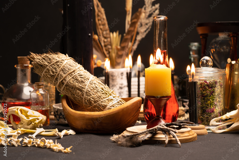 Witch table with witch craft magic items. Selective focus at front ...