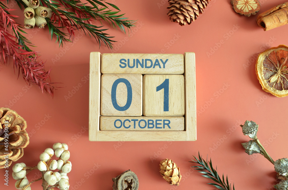 October 1, Cover design with calendar cube, pine cones and dried fruit ...
