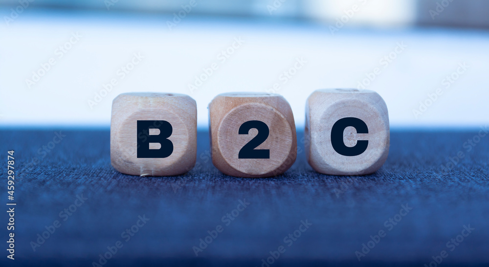 Motivational Words: B2C in 3d wooden alphabet letters on a blue ...