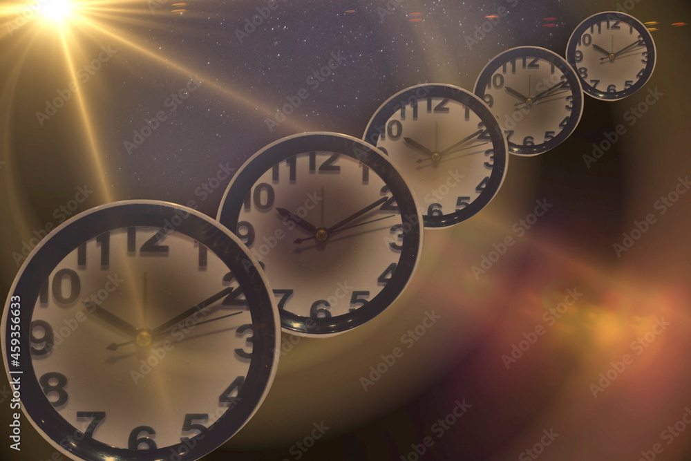 Clocks aligned diagonally on a background representing space and a ...