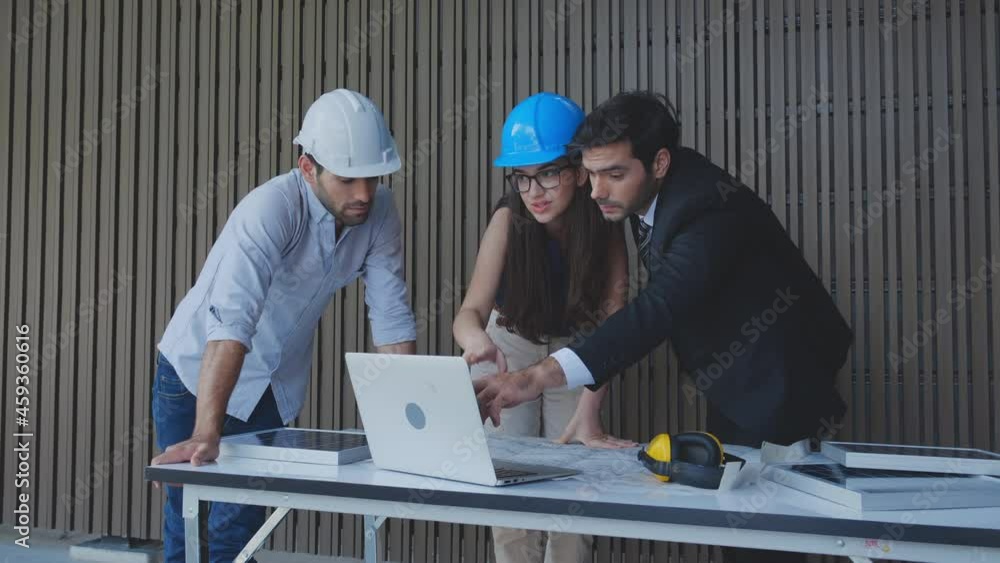 Team engineer discussion and examining panel solar cell with system ...