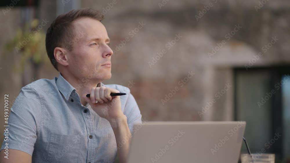 Vidéo Stock Close-up portrait of ponder young man in office. Designer ...