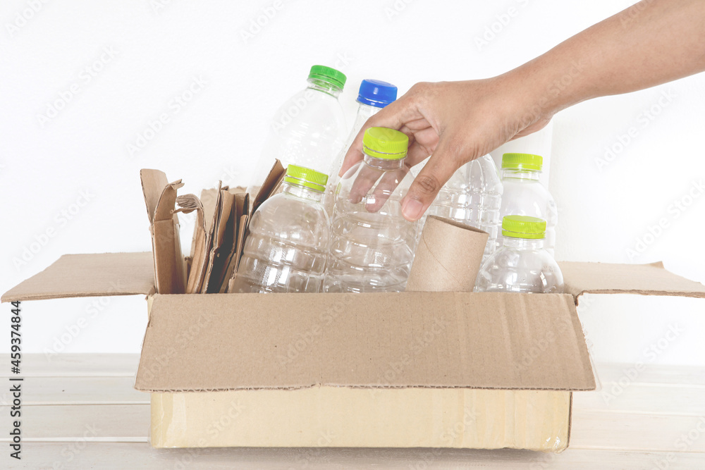 hand holding plastic bottle waste for sorting plastic bottle and paper ...