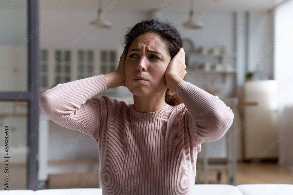 Unhappy Millennial Caucasian Female Renter Or Tenant Cover Ears With