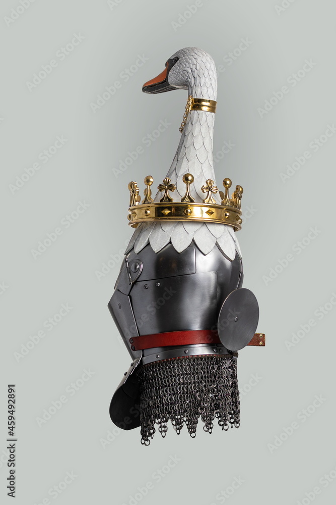 Medieval knightly Milanese helmet with a heraldic kleinod in the form ...