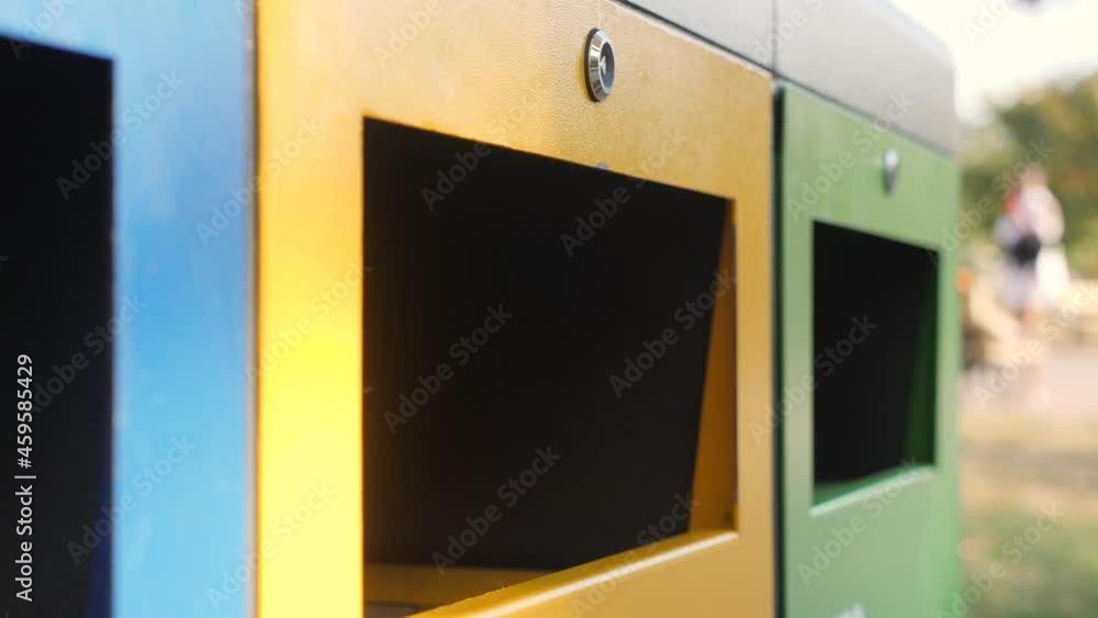 Hold hand crush empty bottle crumpled plastic garbage bin trash sorting ...