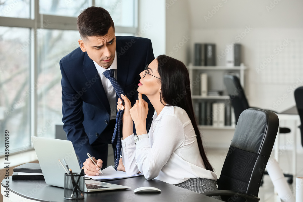 Beautiful young secretary seducing her boss in office. Concept of ... Beautiful young secretary seducing her boss in office. Concept of ...