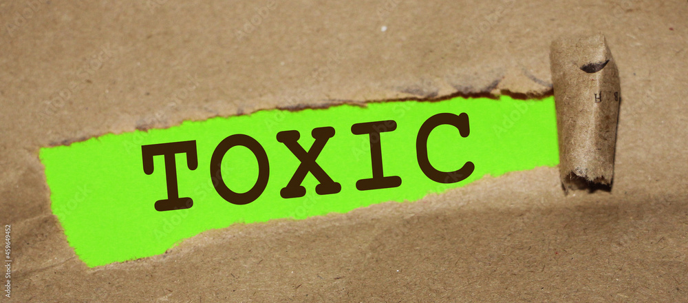 Toxic word uner Brown torn paper with yellow background. Addictions ...