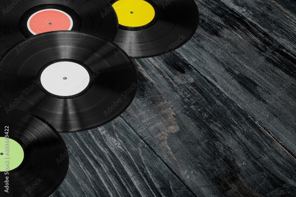 Multi colored vinyl records on a background. Retro or music concept ...