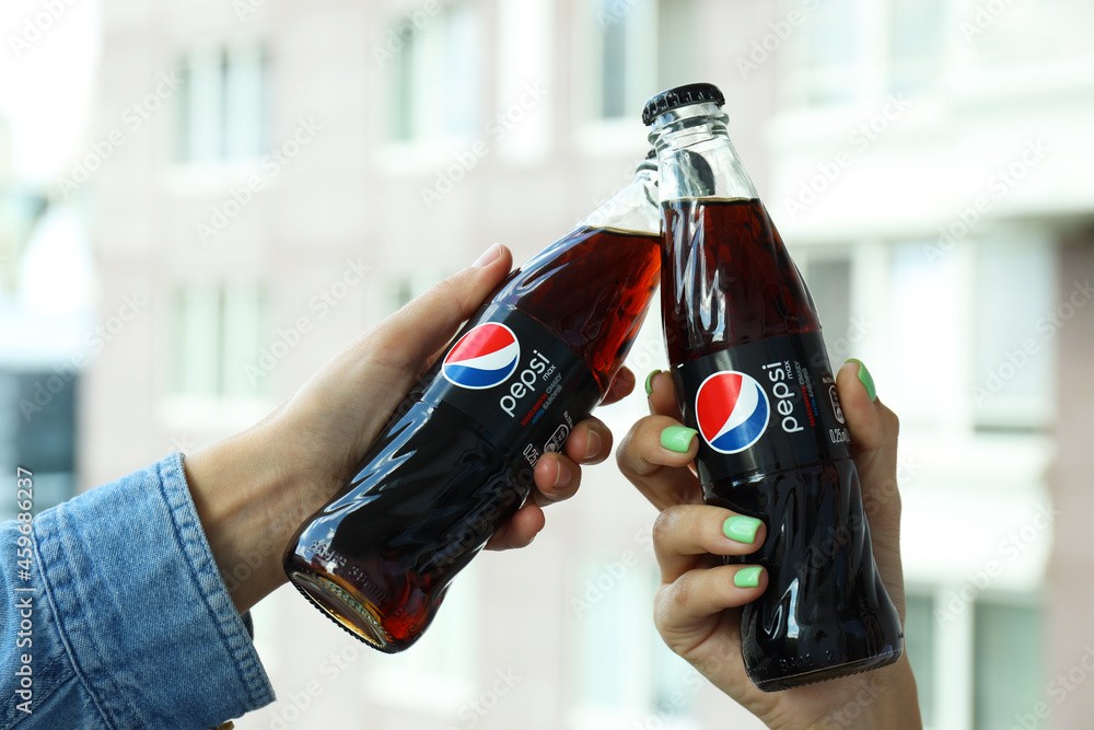 Odessa, Ukraine - September 23, 2021: Female hands cheers with Pepsi ...