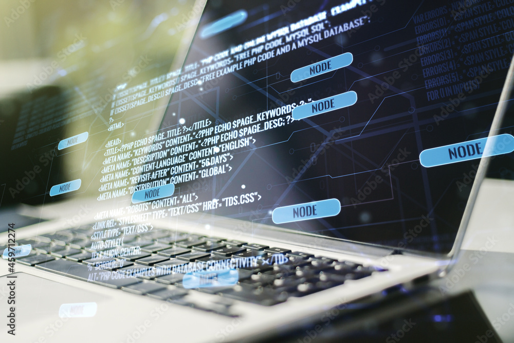 Double exposure of abstract programming language on laptop background ...