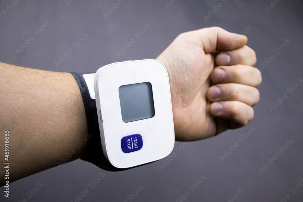Hand and tonometer. Measuring blood pressure.a blood pressure monitor ...