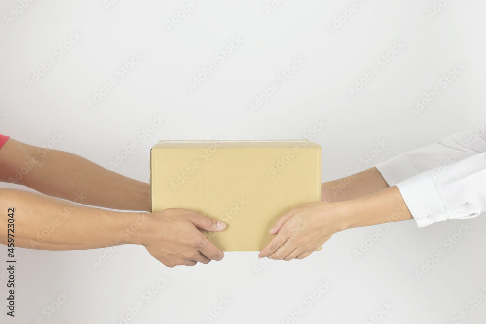 Woman hand receiving a parcel boxes from delivery man. Stock Photo ...