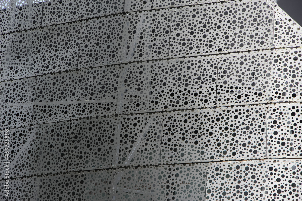 Metal surface with perforations for background Stock Photo | Adobe Stock
