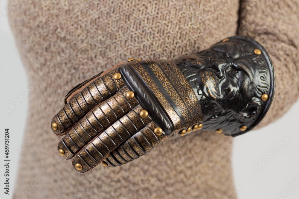 Medieval knightly brown plate gauntlet from Italian armor, in the form ...