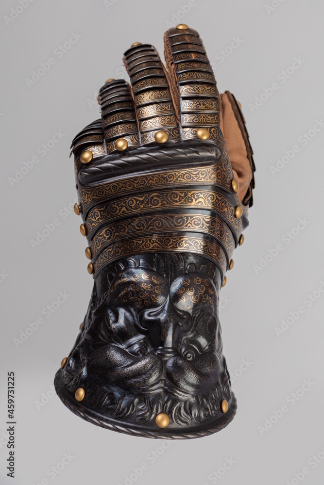 Medieval knightly brown plate gauntlet from Italian armor, in the form ...