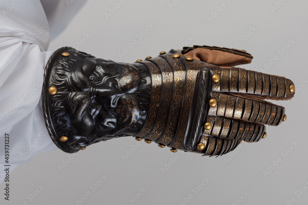 Medieval knightly brown plate gauntlet from Italian armor, in the form ...