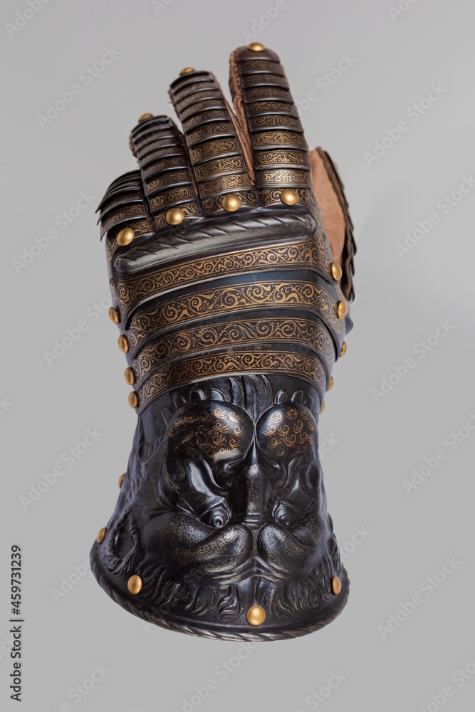 Medieval knightly brown plate gauntlet from Italian armor, in the form ...