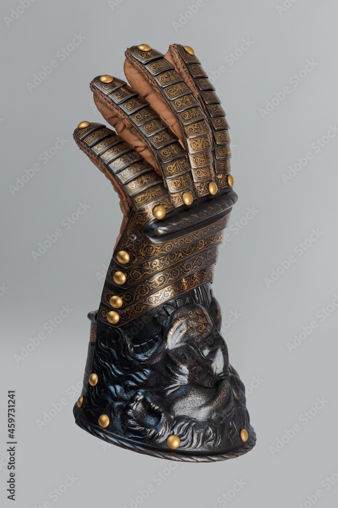 Medieval knightly brown plate gauntlet from Italian armor, in the form ...