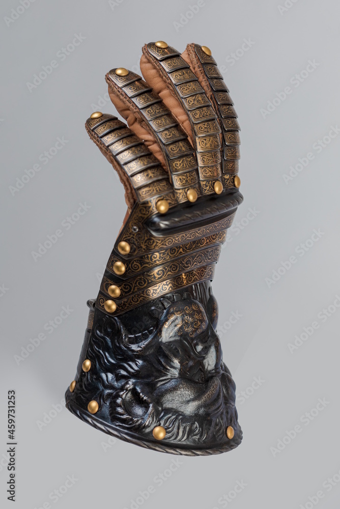 Medieval knightly brown plate gauntlet from Italian armor, in the form ...