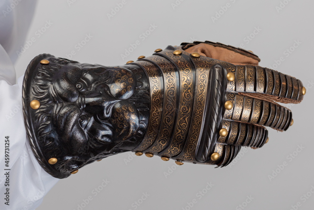 Medieval knightly brown plate gauntlet from Italian armor, in the form ...