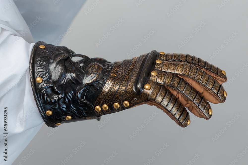 Medieval knightly brown plate gauntlet from Italian armor, in the form ...