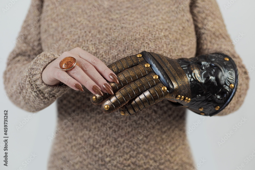 Medieval knightly brown plate gauntlet from Italian armor, in the form ...