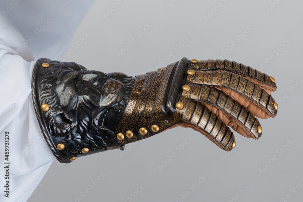 Medieval knightly brown plate gauntlet from Italian armor, in the form ...
