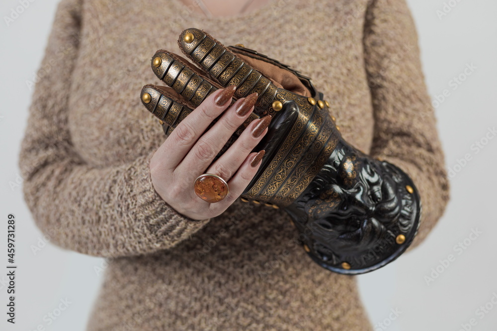 Medieval knightly brown plate gauntlet from Italian armor, in the form ...