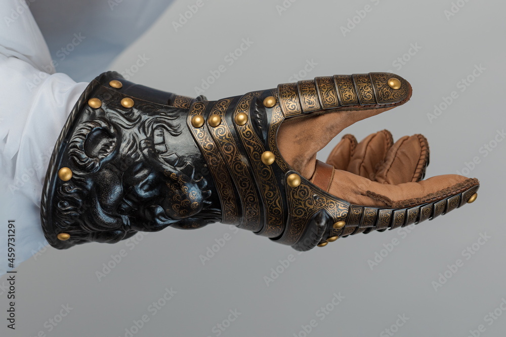 Medieval knightly brown plate gauntlet from Italian armor, in the form ...