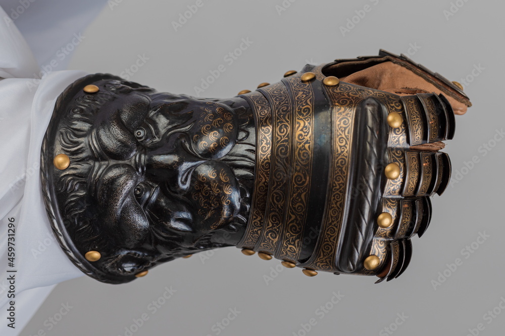 Medieval knightly brown plate gauntlet from Italian armor, in the form ...