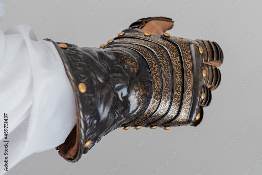 Medieval knightly brown plate gauntlet from Italian armor, in the form ...